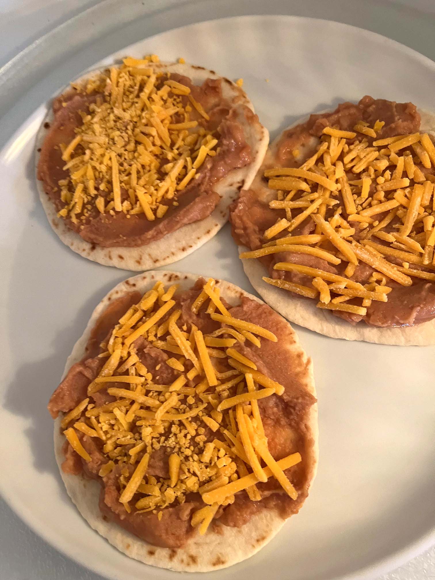 Microwave Refried Bean and Cheese Tacos 5-Minute Recipe – Melanie Cooks